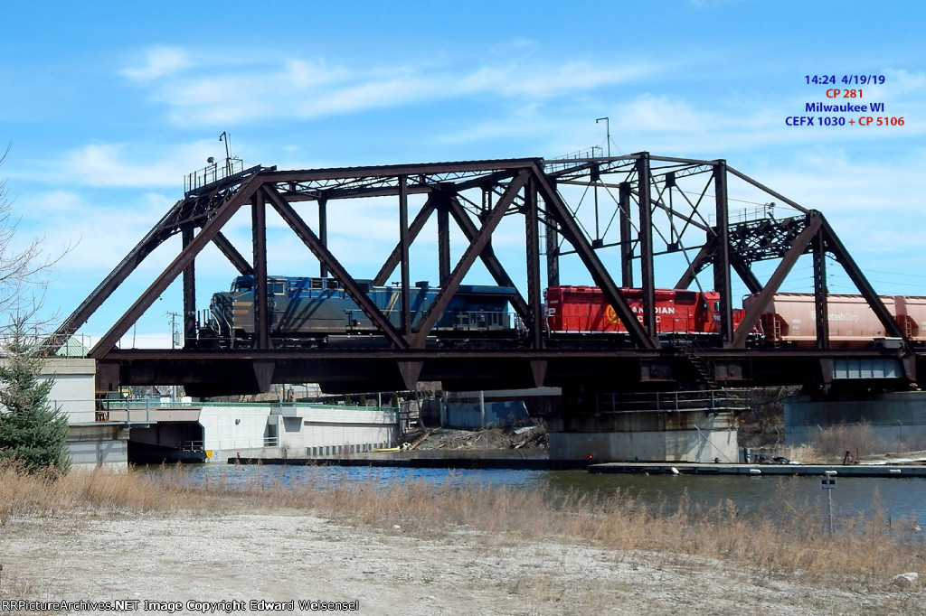 Bluebird 1030 and SD40-3 CP 5106 lead 281 across the KK river